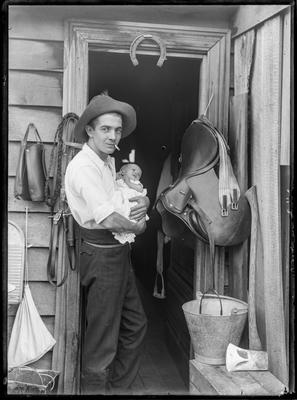 E A Millard holding baby - Tairawhiti Museum